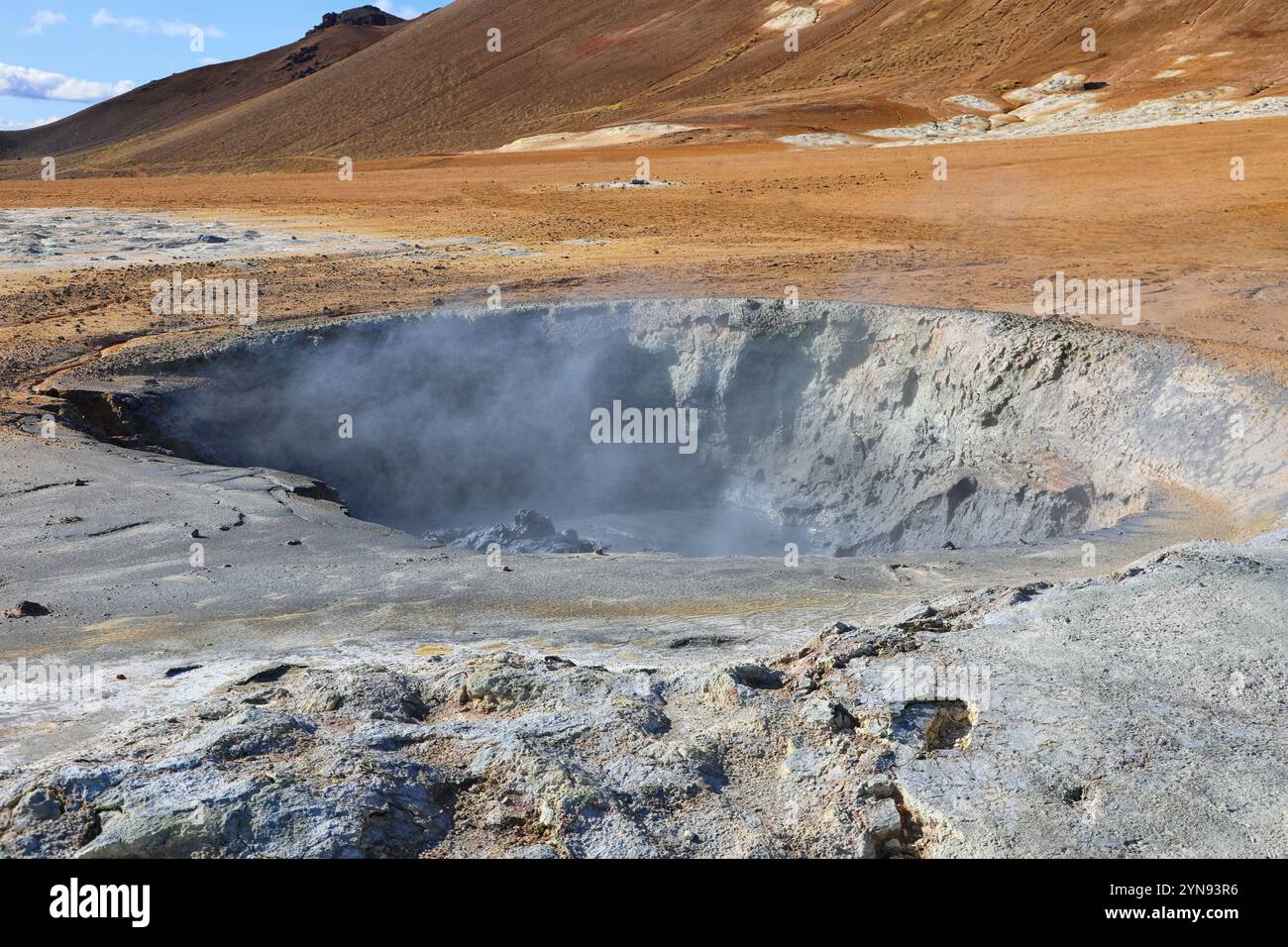Volcanic boiling mud pots surrounded by sulfur hot springs in Hverir ...