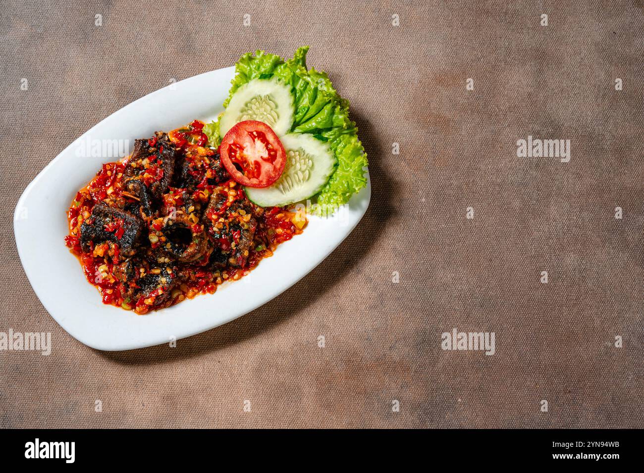 Fried eel or belut goreng with sambal balado is a Indonesian ...