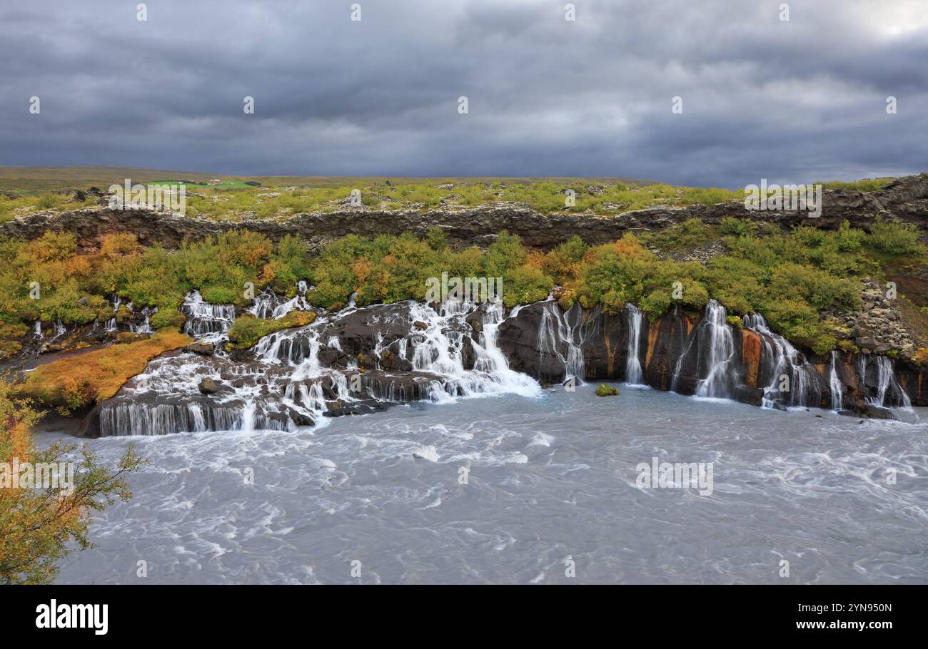 Hraunfossar is a series of waterfalls formed by rivulets streaming over ...