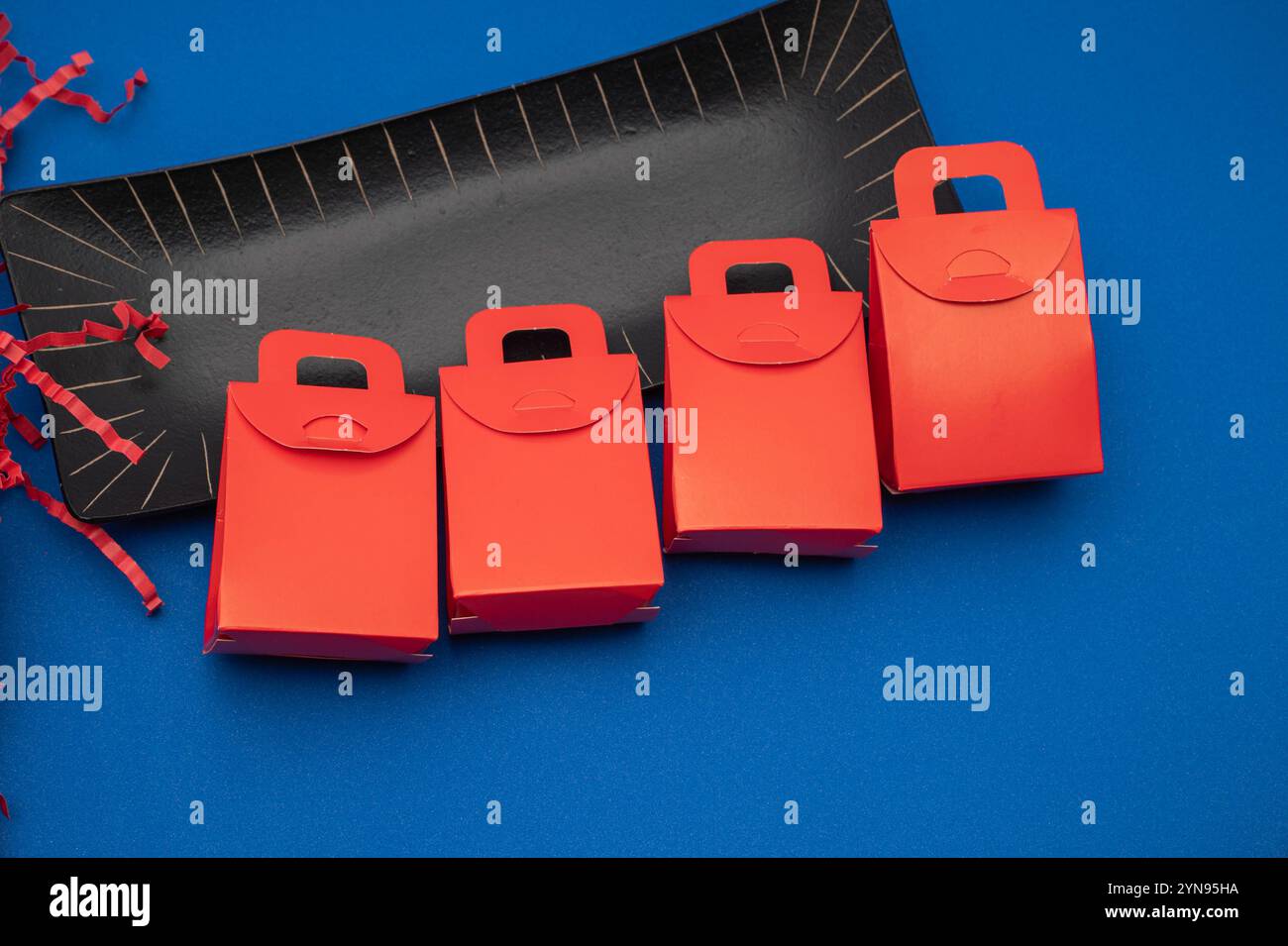 Red boxes on blue background Stock Photo - Alamy
