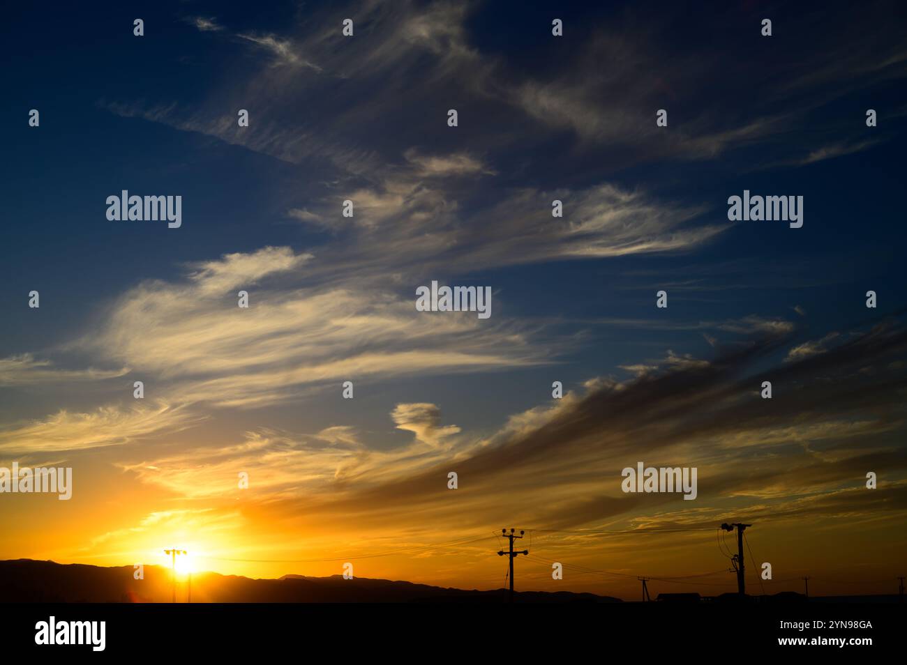 A breathtaking sunset illuminates the sky, showcasing vibrant colors ...