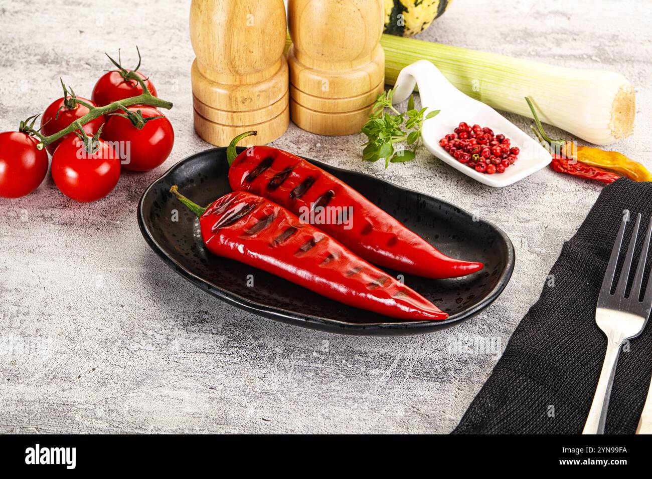 Grilled red spicy pepper snack in the bowl Stock Photo - Alamy