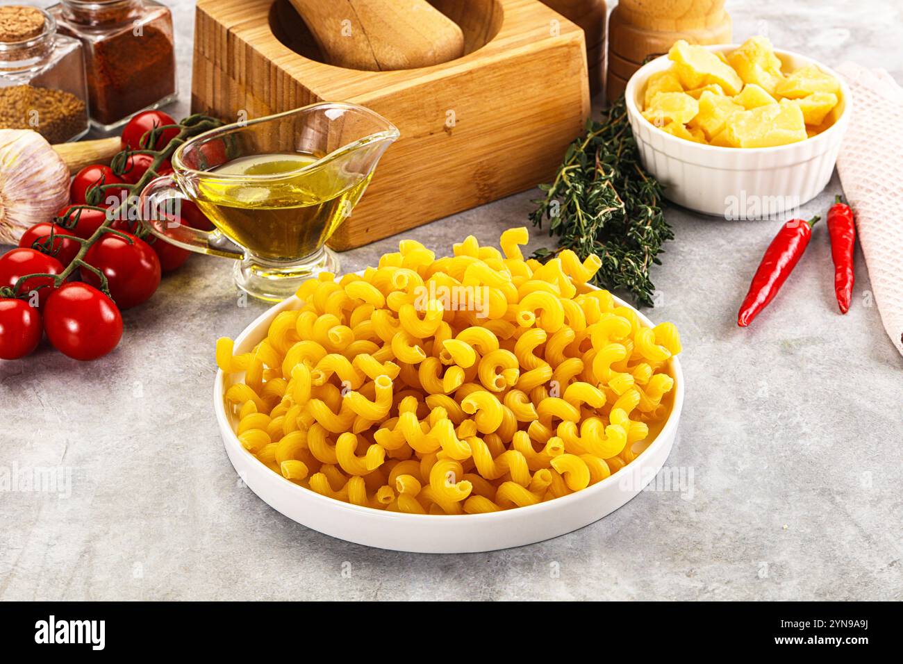 Italian cuisine - dry cellentani pasta for cooking Stock Photo - Alamy