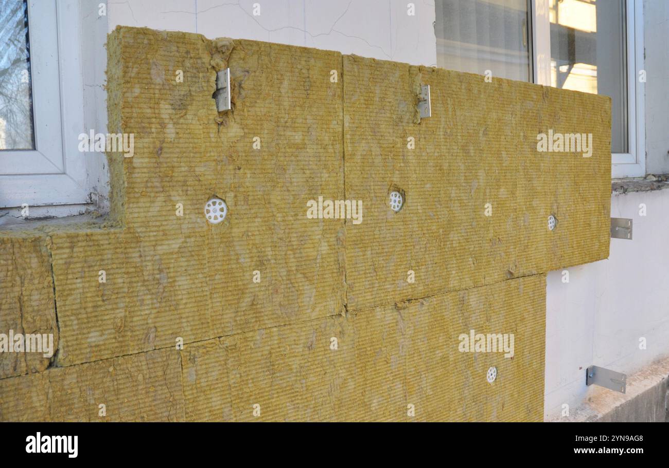 External solid wall insulation with mineral wool. House facade ...
