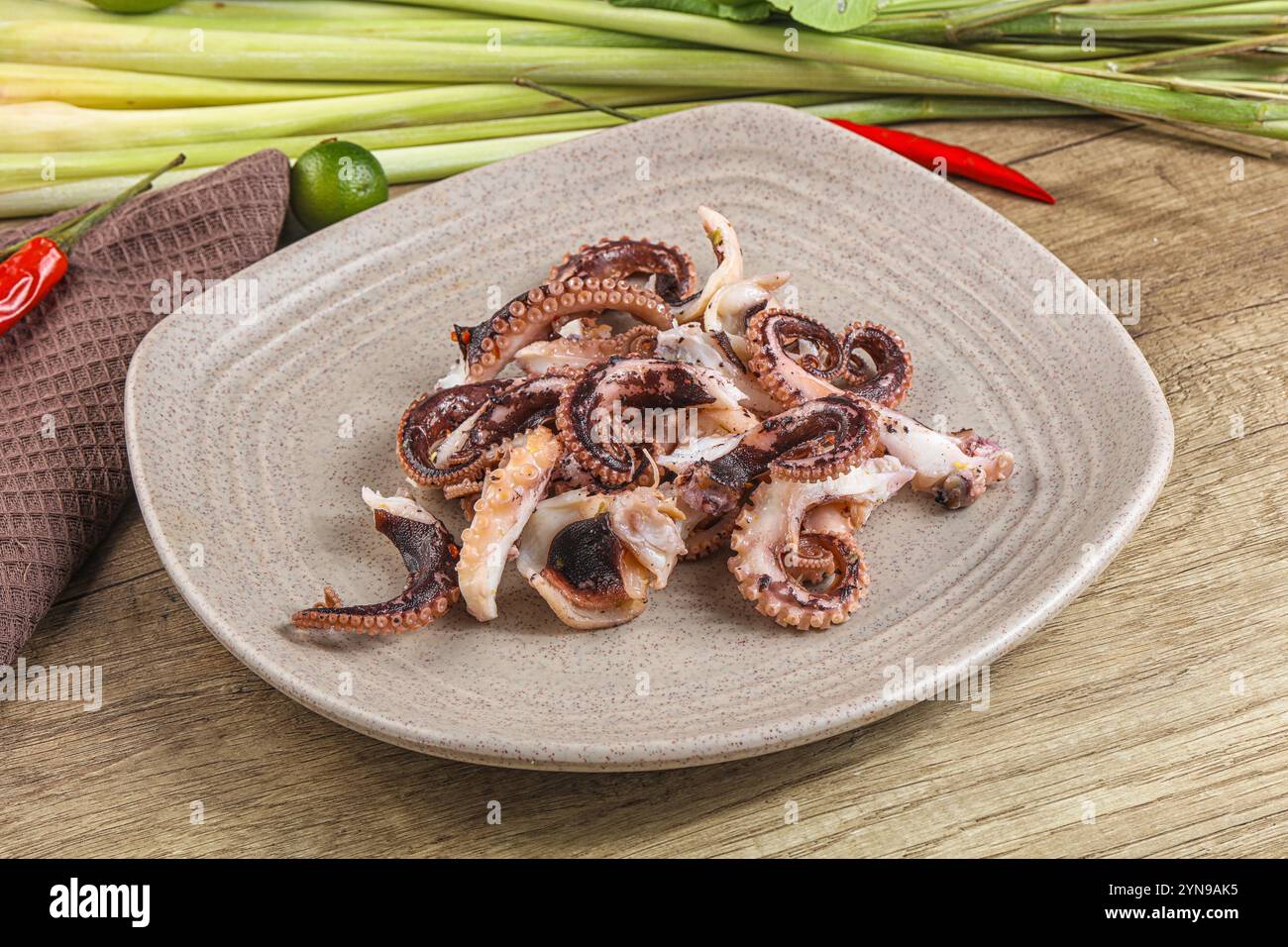 Grilled octopus red tentacle sliced appetizer Stock Photo - Alamy