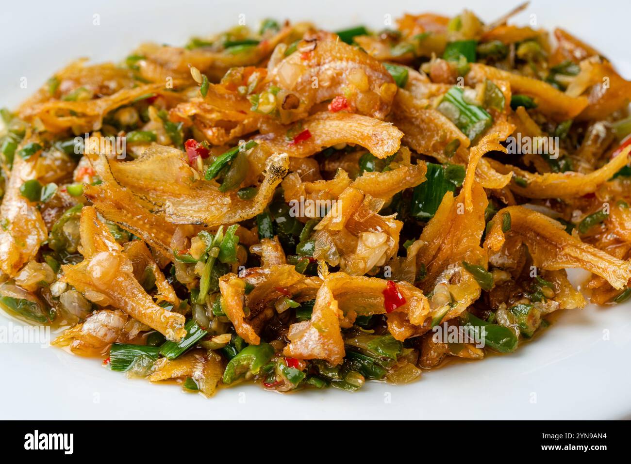 Fried anchovy cooked with green chili or ikan teri cabe ijo is a ...