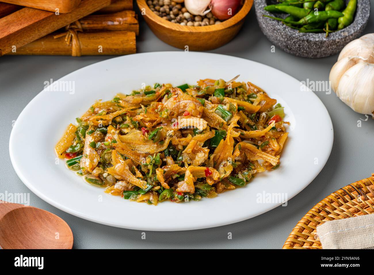 Fried anchovy cooked with green chili or ikan teri cabe ijo is a ...