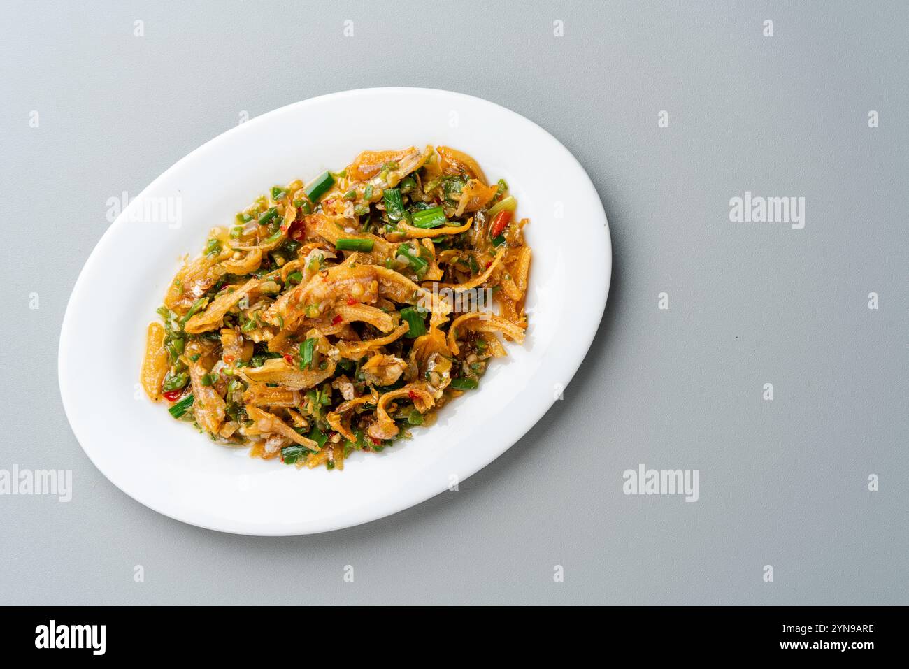 Fried anchovy cooked with green chili or ikan teri cabe ijo is a ...