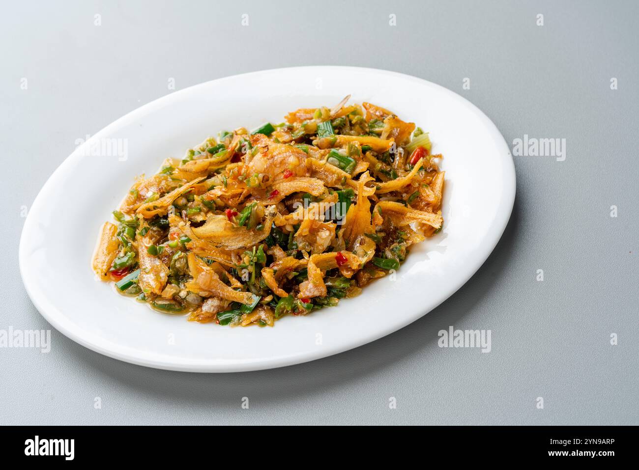 Fried anchovy cooked with green chili or ikan teri cabe ijo is a ...