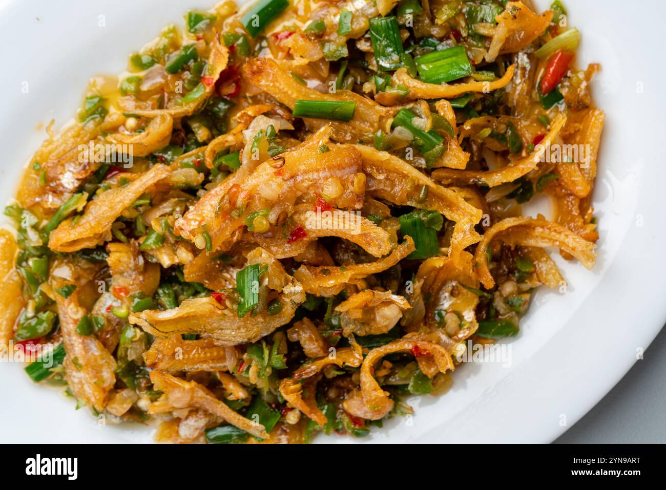 Fried anchovy cooked with green chili or ikan teri cabe ijo is a ...