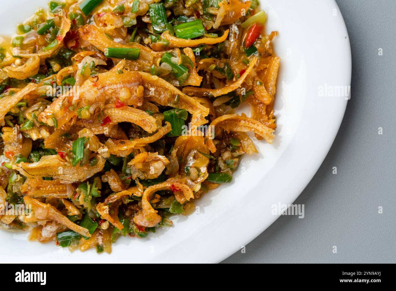 Fried anchovy cooked with green chili or ikan teri cabe ijo is a ...