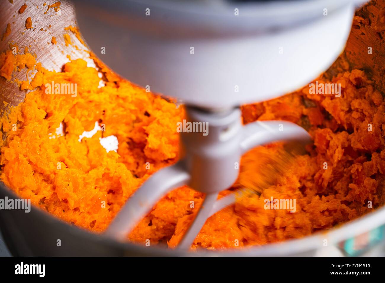 The process of making carrot puree in a planetary mixer. Healthy ...