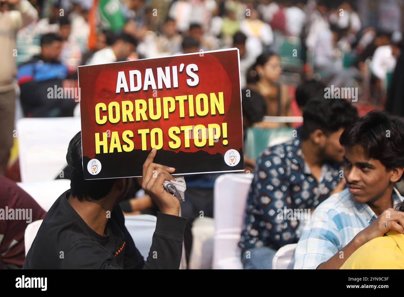 Supporter of Indian Youth Congress holds a placard during a massive ...