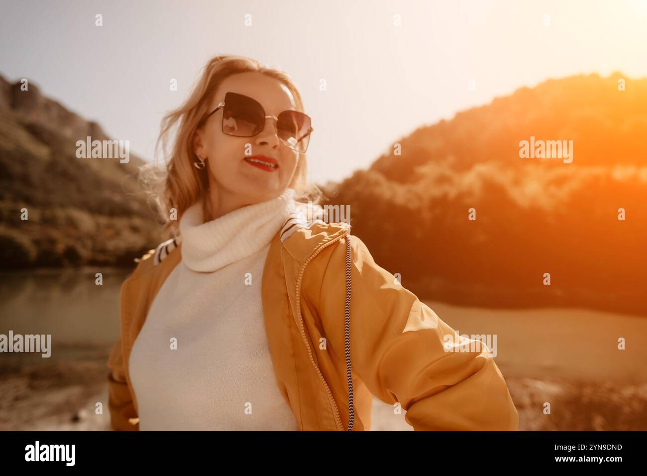 Woman in yellow jacket looks hi-res stock photography and images - Alamy