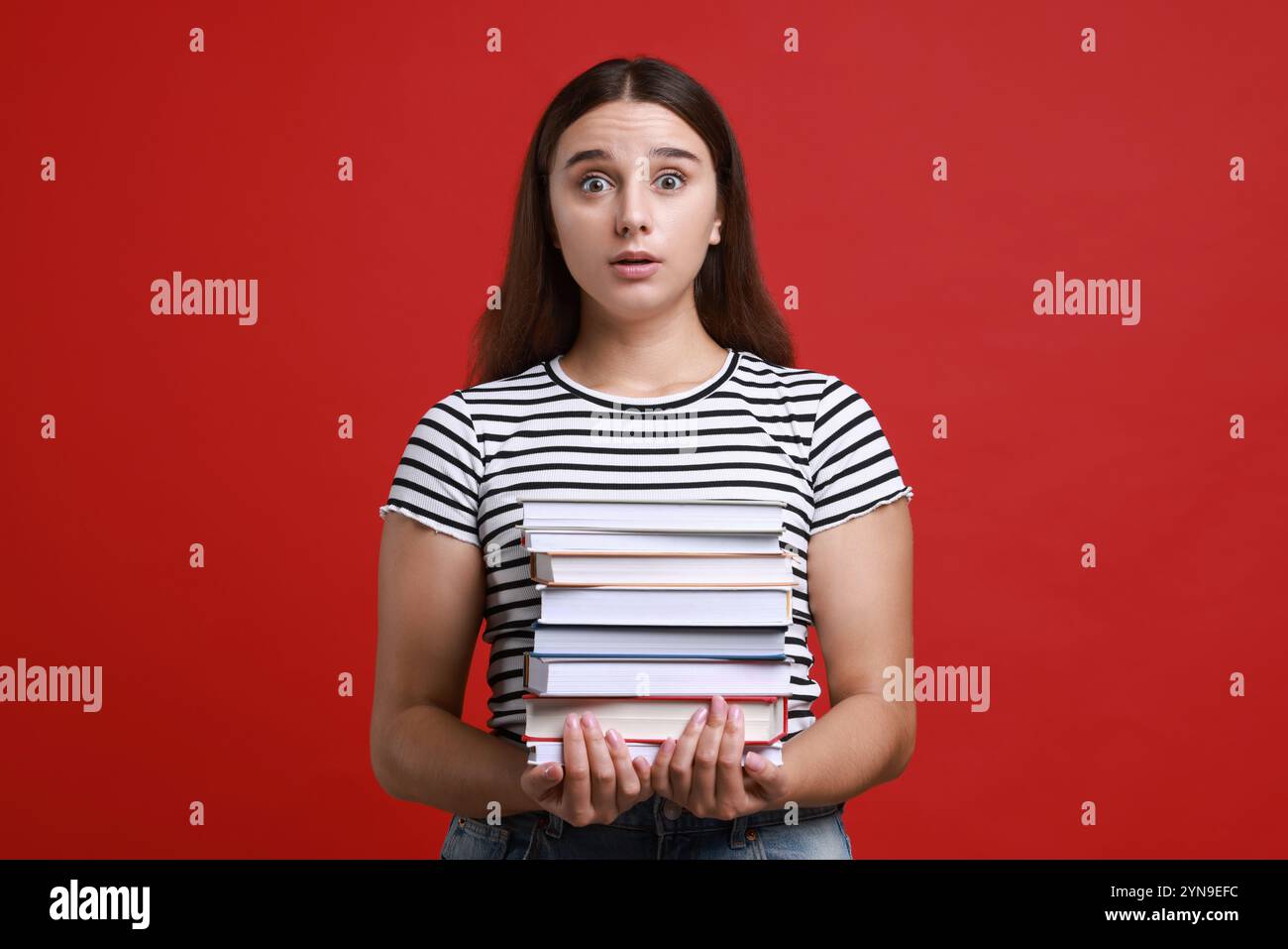 Emotional student stack books hi-res stock photography and images - Alamy