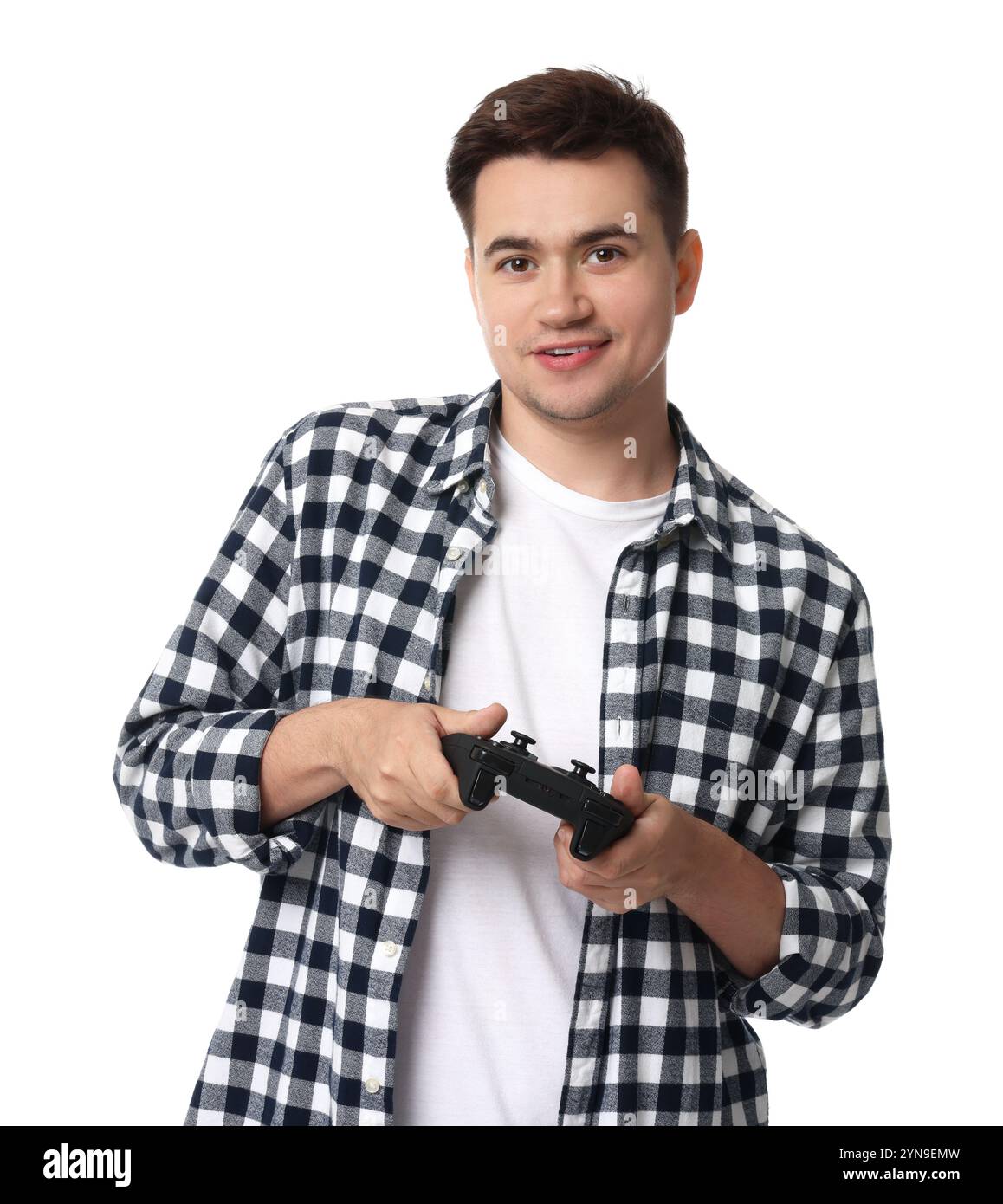 Young man playing video games with controller on white background Stock ...