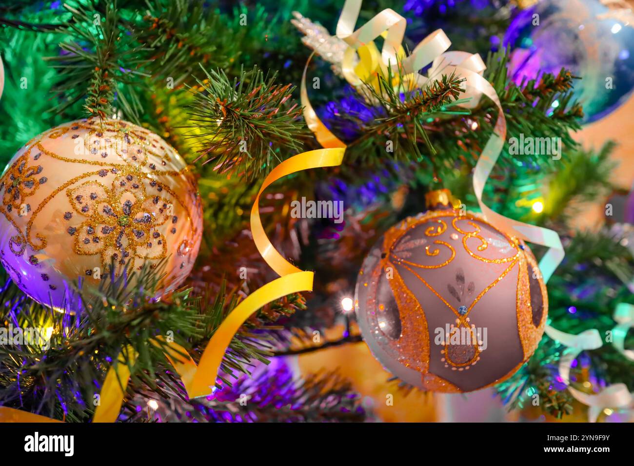 Christmas tree decorations. Gray and beige balls with golden patterns ...