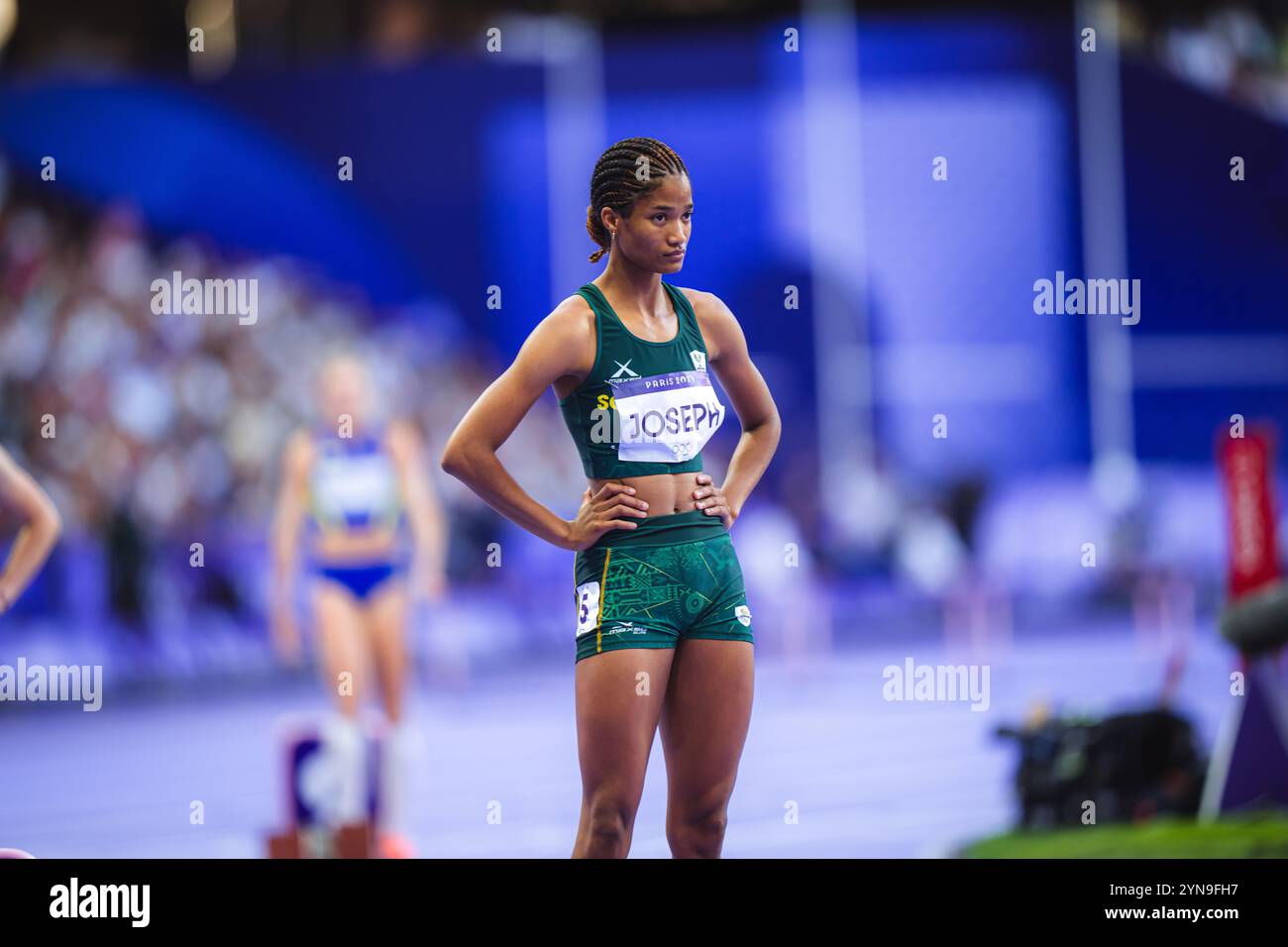 Rogail Joseph participating in the 400 meters hurdles at the Paris 2024 ...