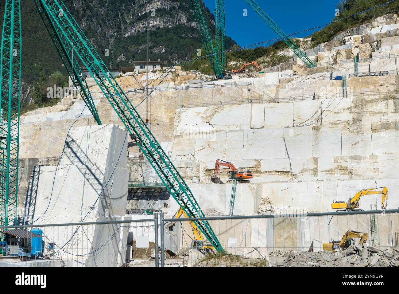 Marble quarry with excavators and cranes, Fine marble from the Ossola ...