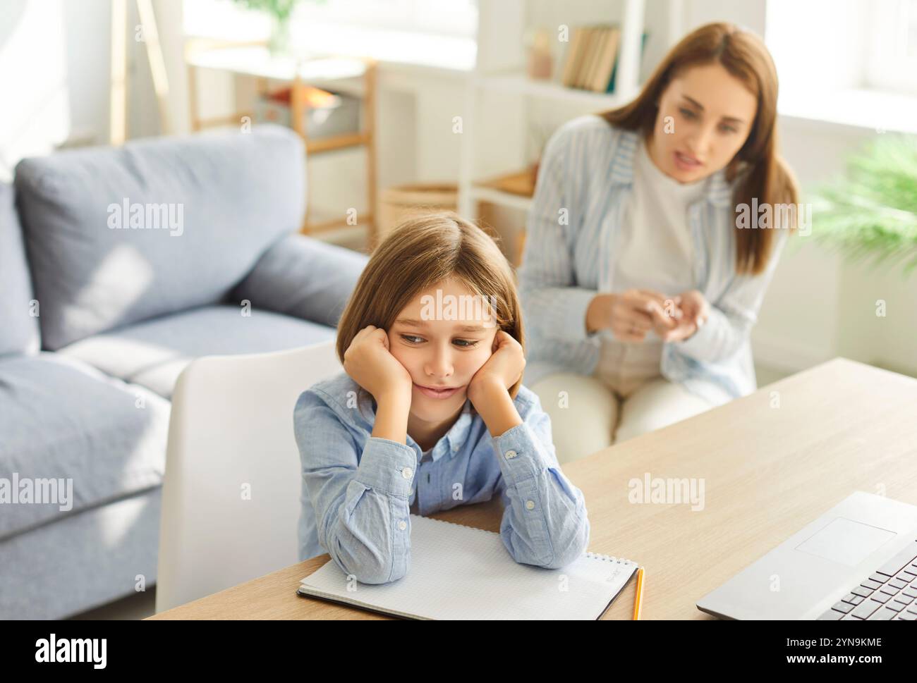 Tired frustrated bored teenager, mother scolding child, boy at home ...