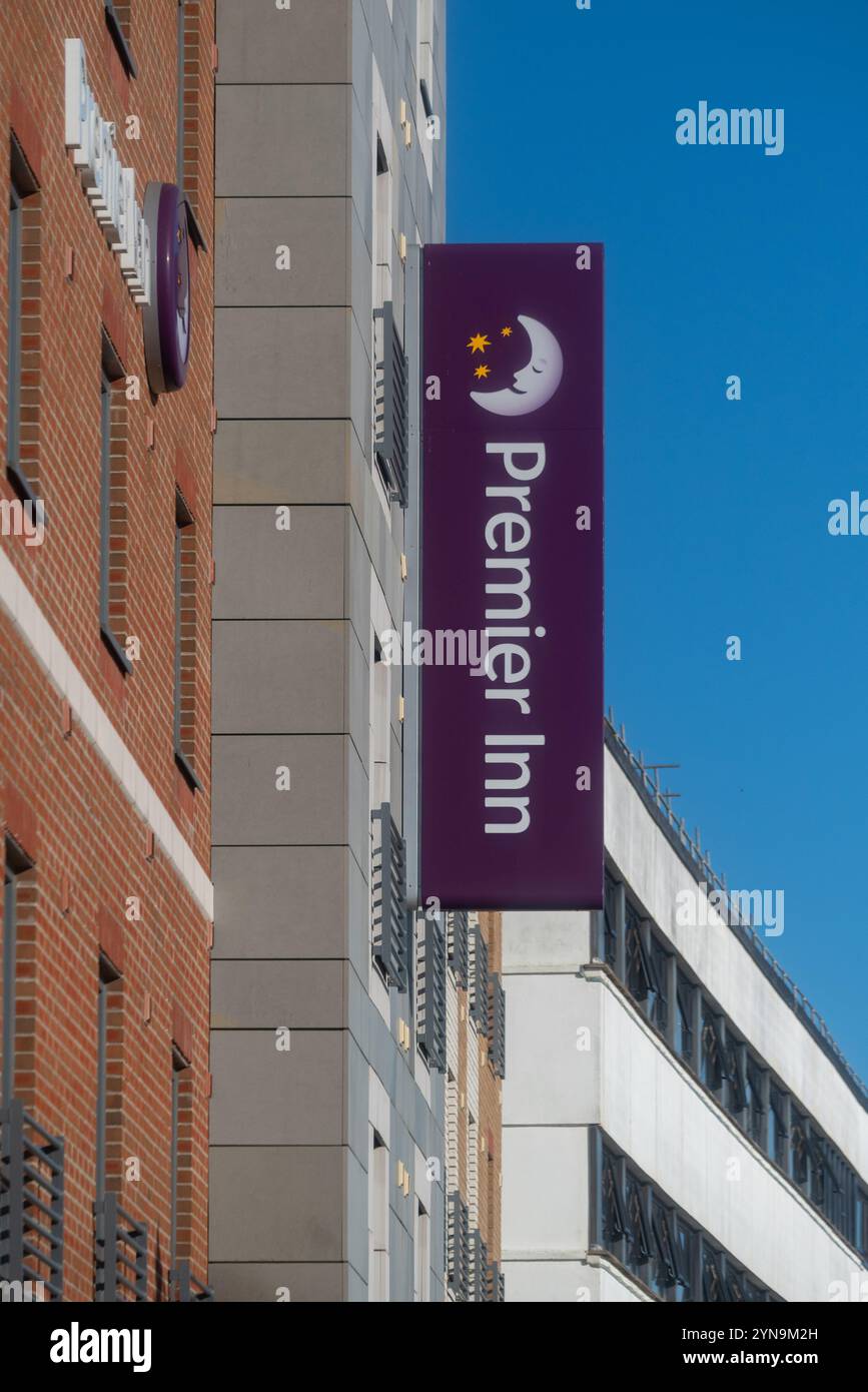 Premier Inn sign with company name and logo on the exterior of one of ...