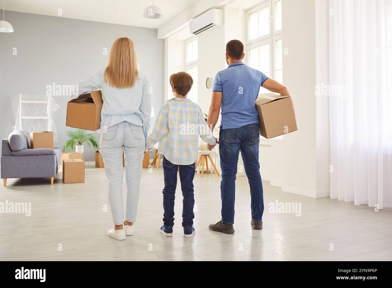 Family, owners moving new flat, enter, leave home residence rear view ...