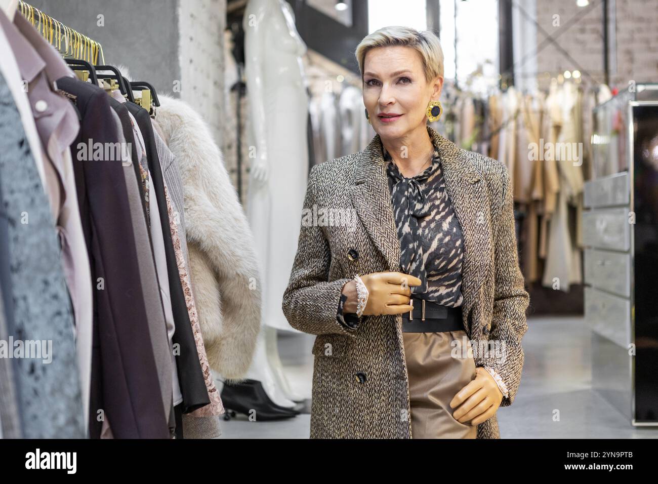 Stylish Mature Woman with Short Hair in Fashionable Clothing Standing ...