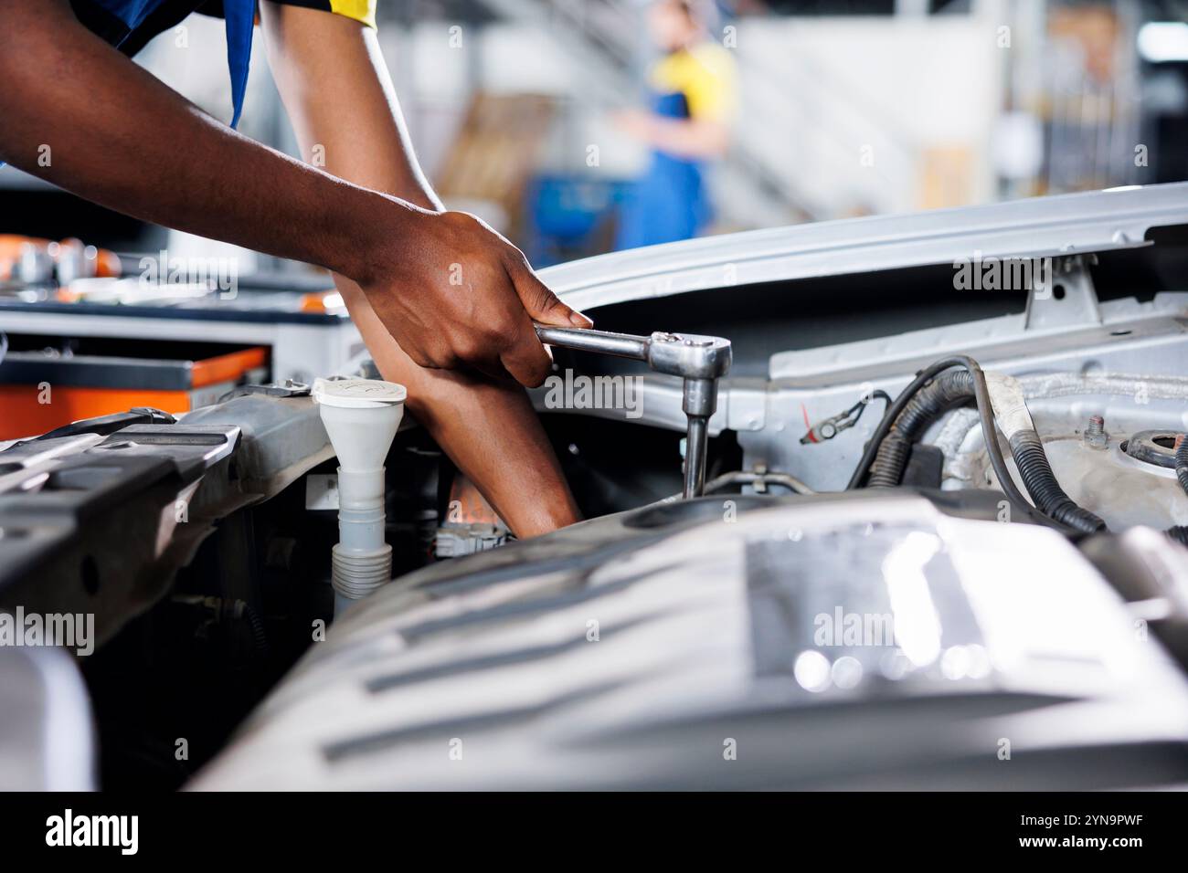 Engineer expertly examines car lights system using advanced mechanical ...