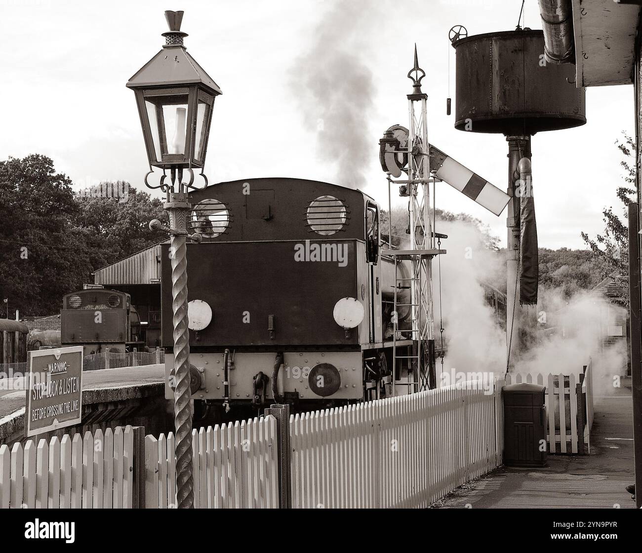 Railway engine letting off steam Stock Photo - Alamy