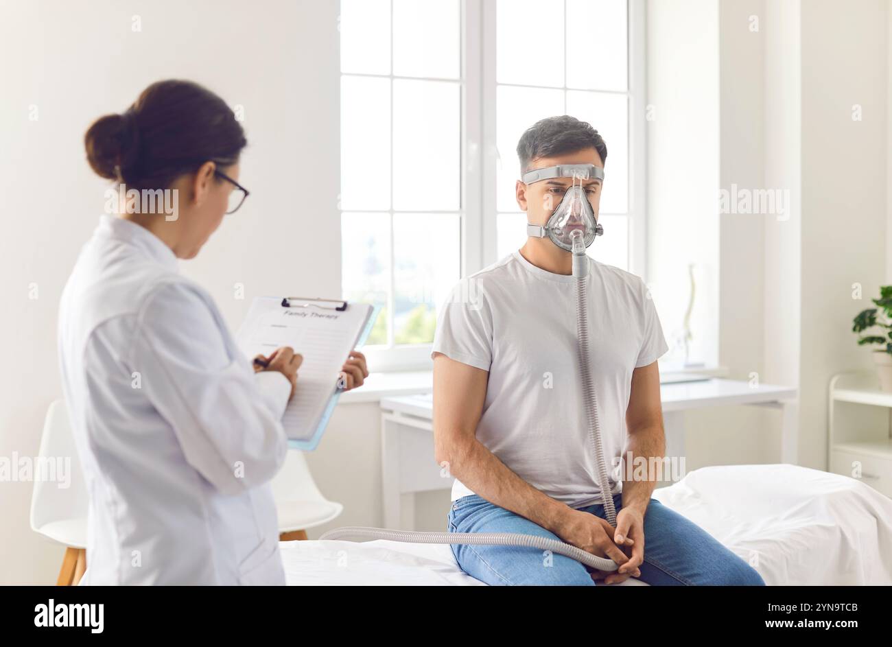 Man Inhaling Oxygen With Doctor And Nurse In Hospital Stock Photo - Alamy