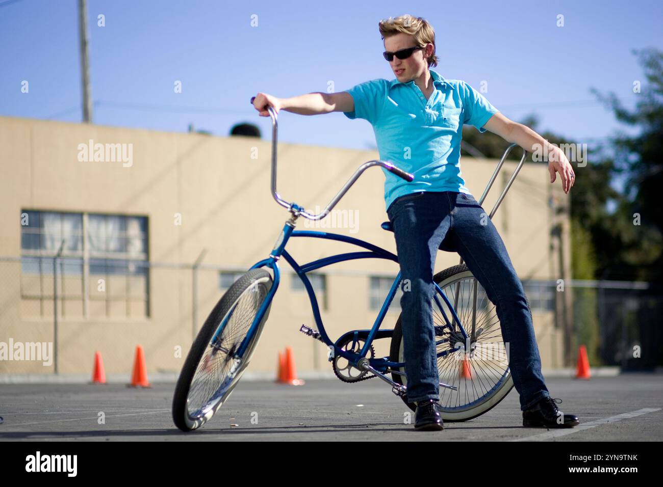 A male model rests on his bicycle during a photo shoot in Los Angeles ...