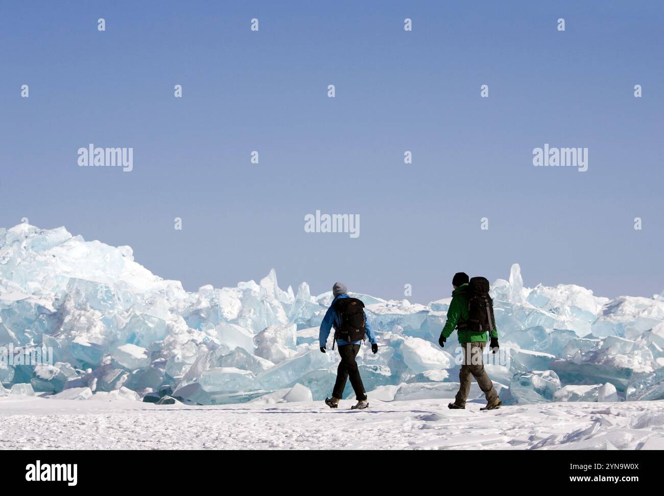 Hikers on the frozen Lake Baikal during the winter in Siberia, Russia ...