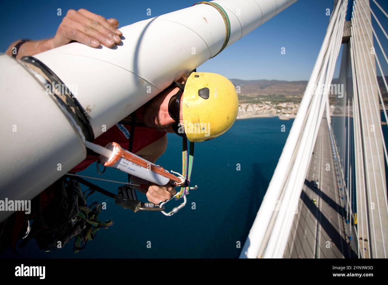 A man working on the maintenance of the world's longest cable-stayed ...