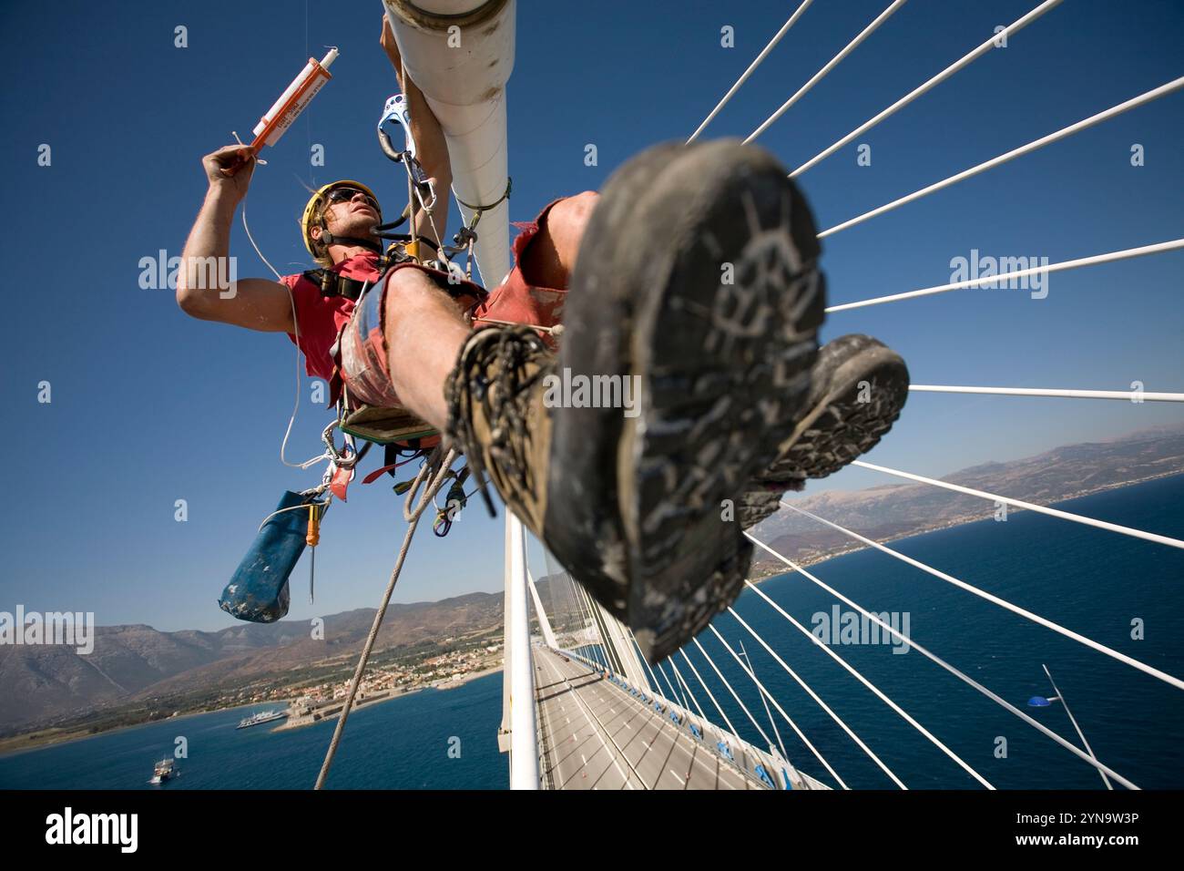 A man working on the maintenance of the world's longest cable-stayed ...