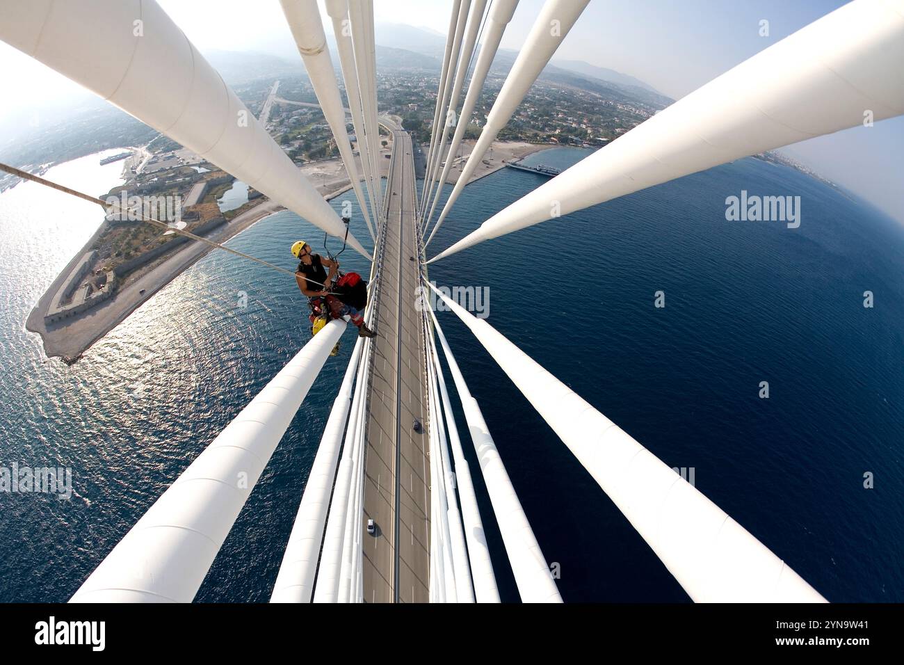 A man working on the maintenance of the world's longest cable-stayed ...