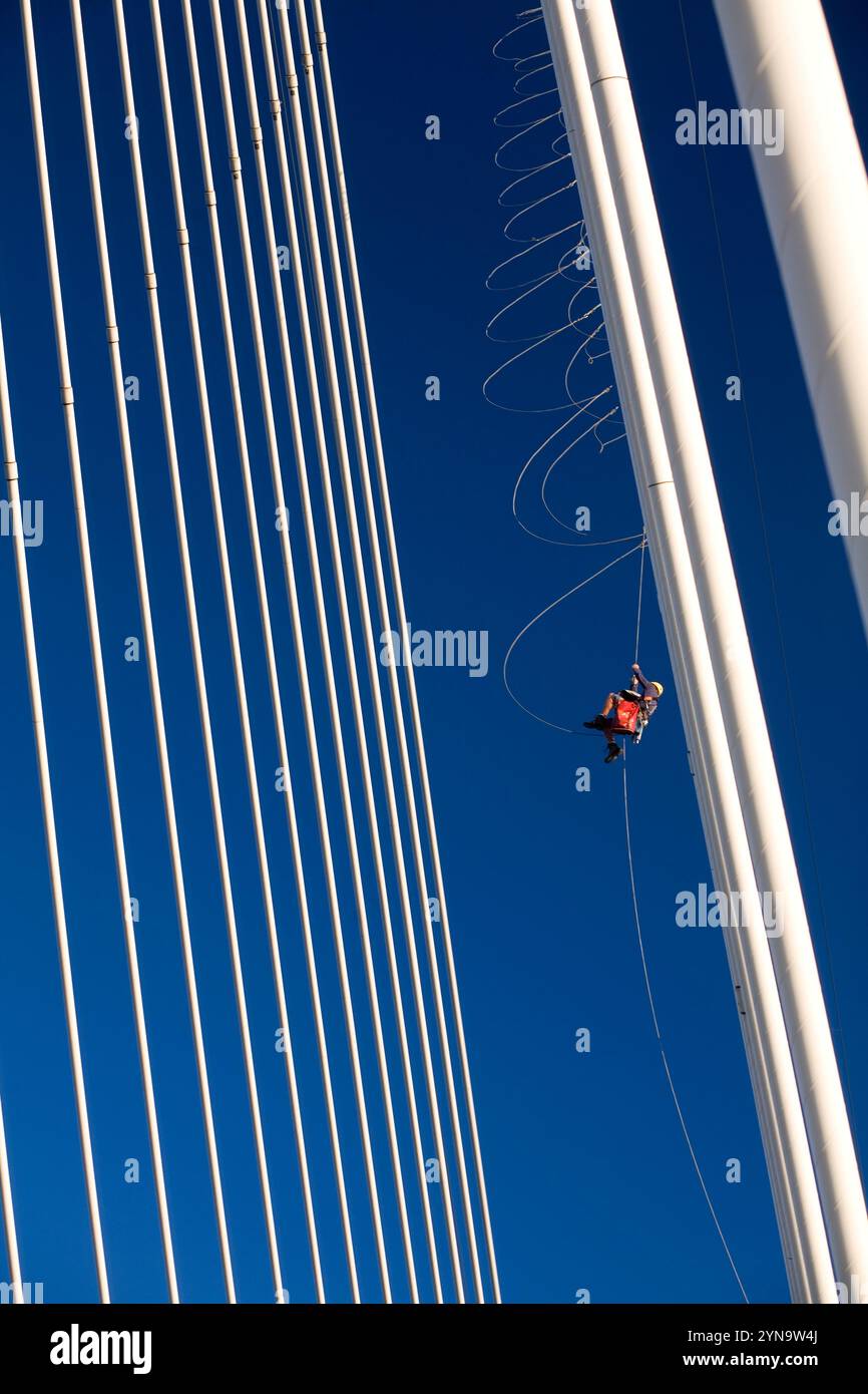 A man working on the maintenance of the world's longest cable-stayed ...