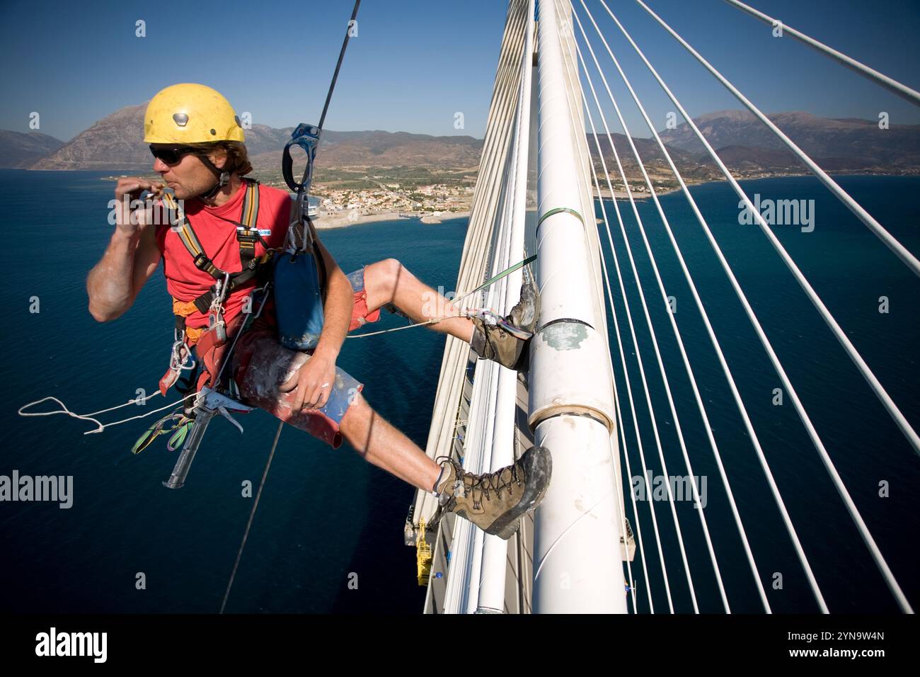 A man working on the maintenance of the world's longest cable-stayed ...