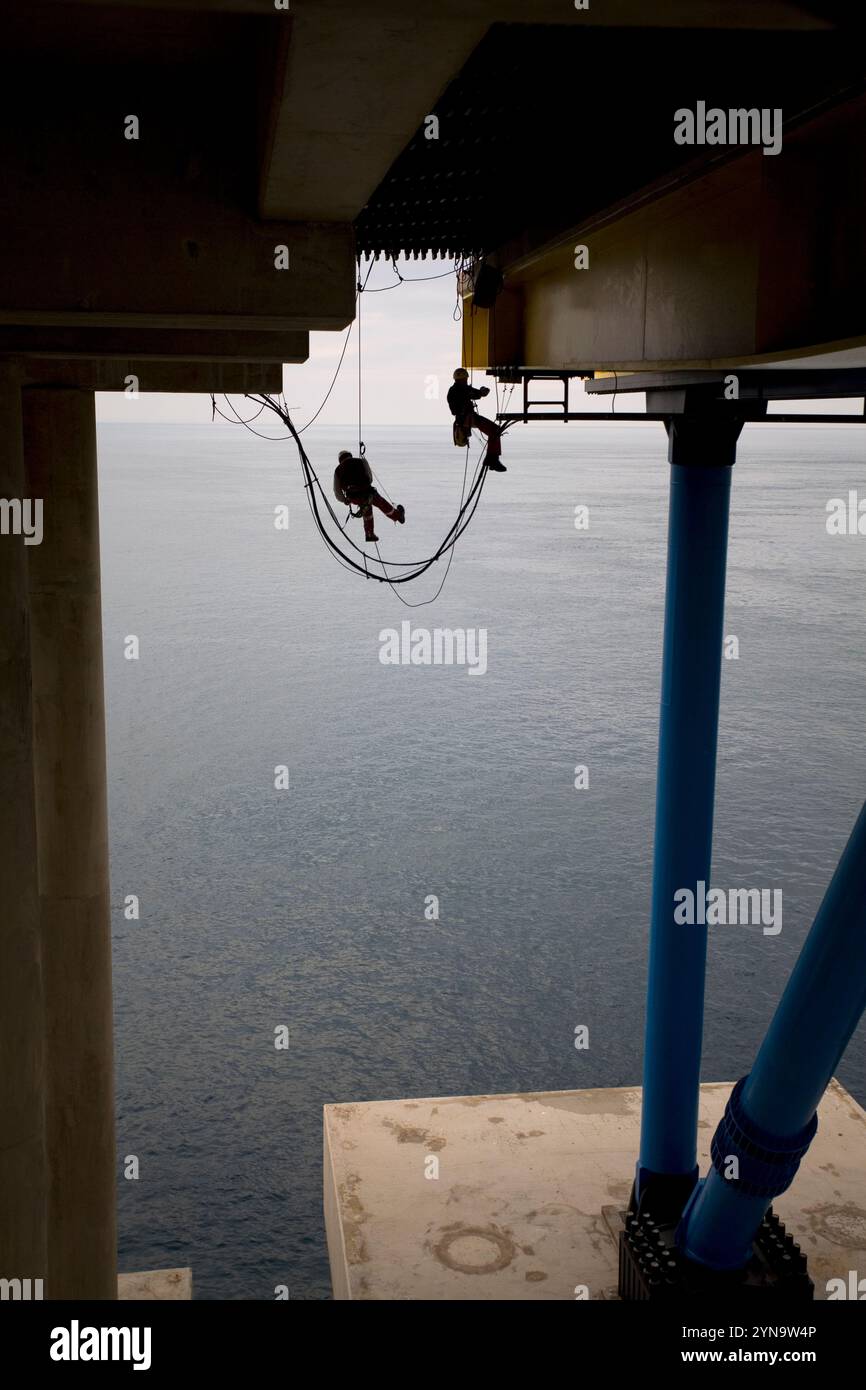 Two men working on the maintenance of the world's longest cable-stayed ...