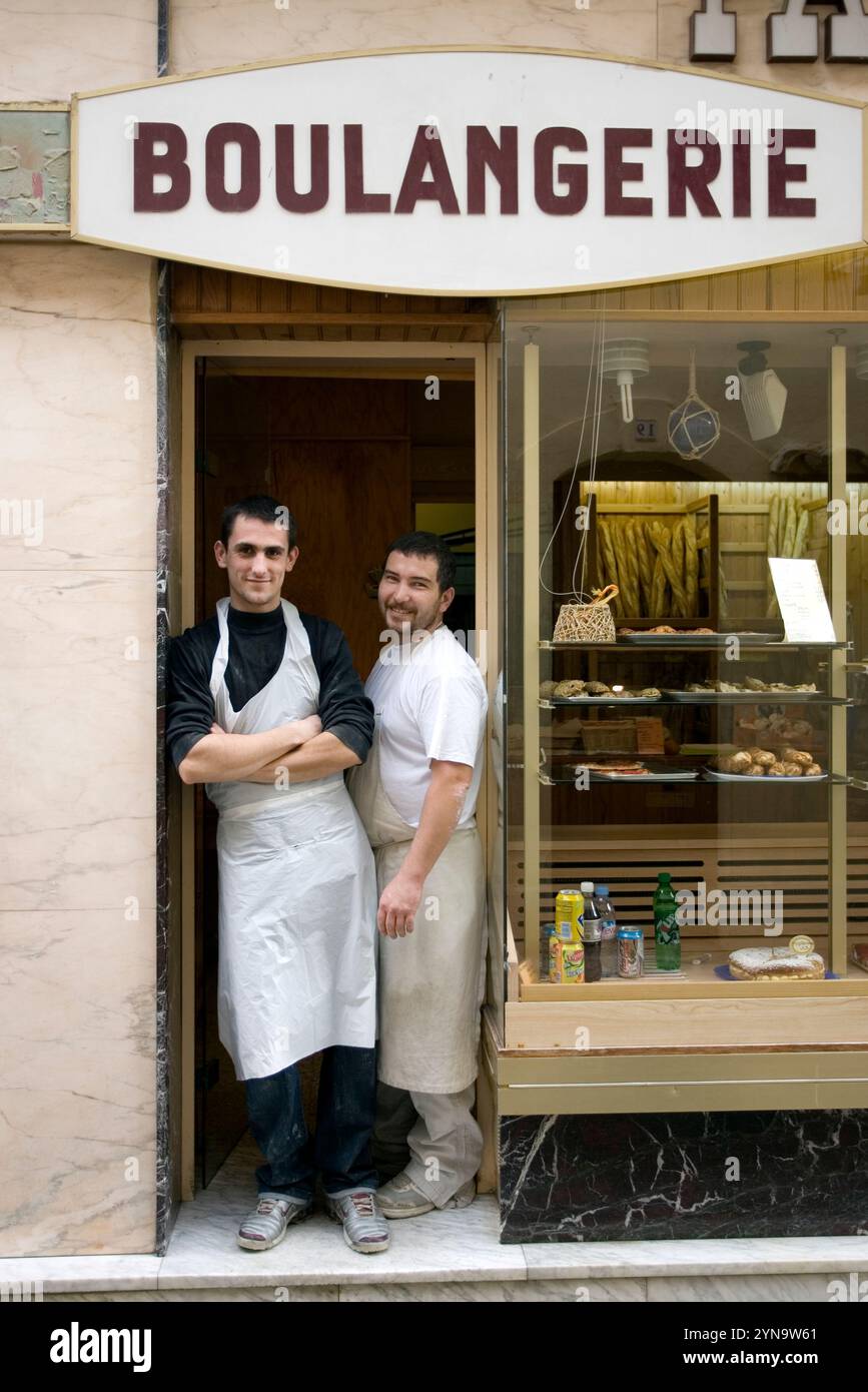 Two workers pose in front of their bakery in Cassis, France Stock Photo ...