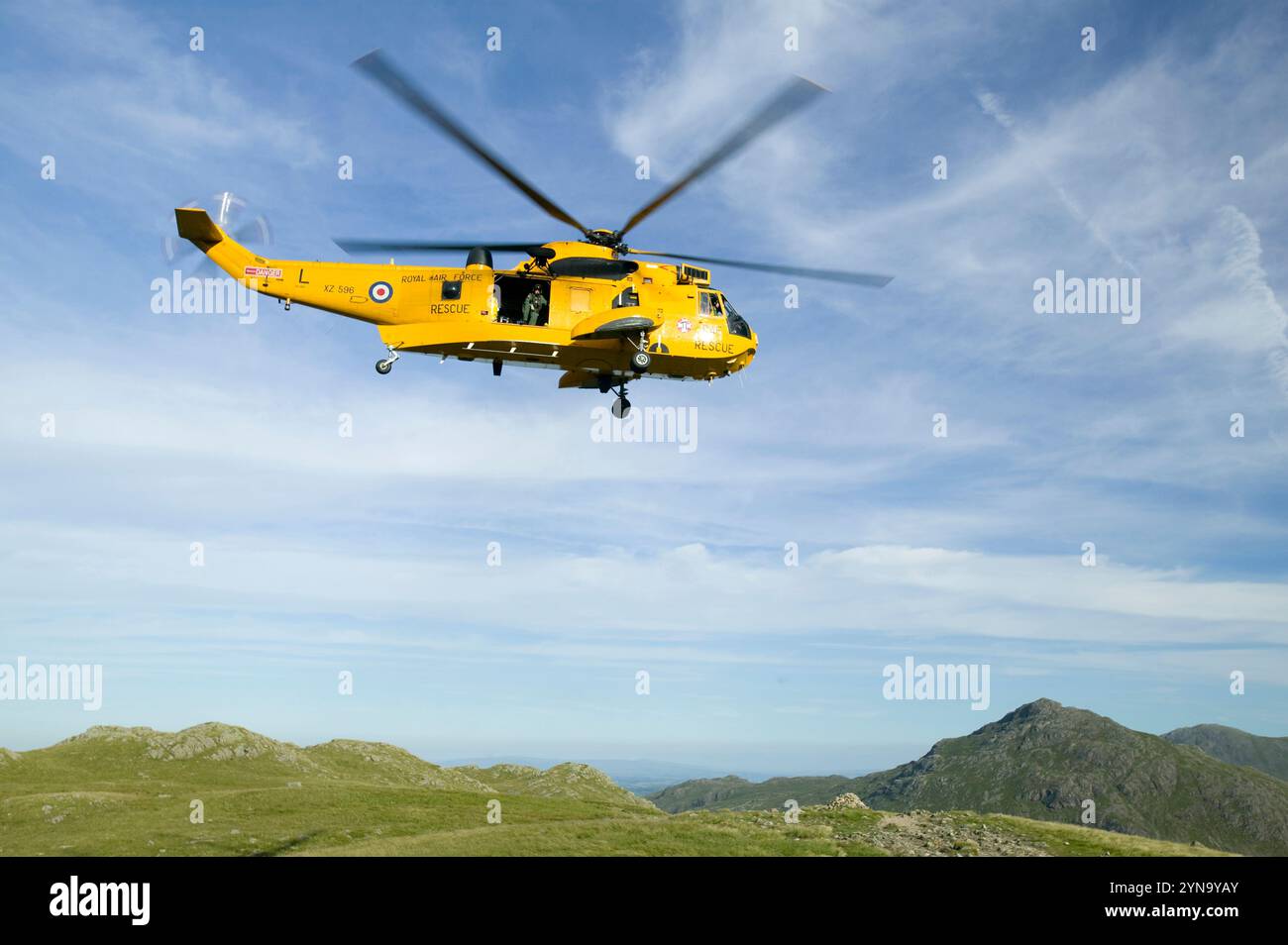 A helicopter comes to evacuate an injured walker on Bow Fell in the ...