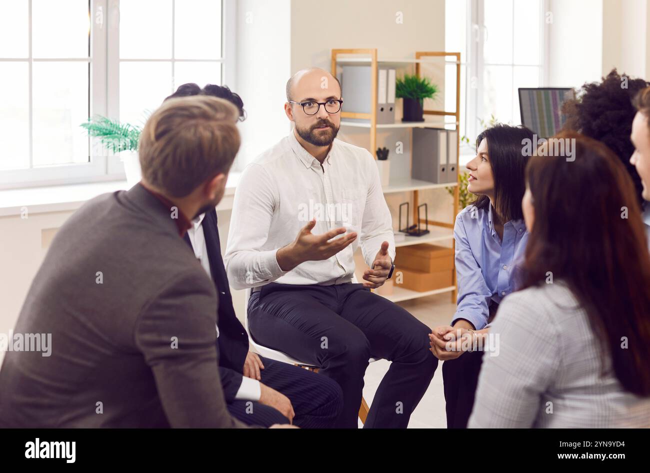 Adult mature man speaking at group therapy circle on motivational ...