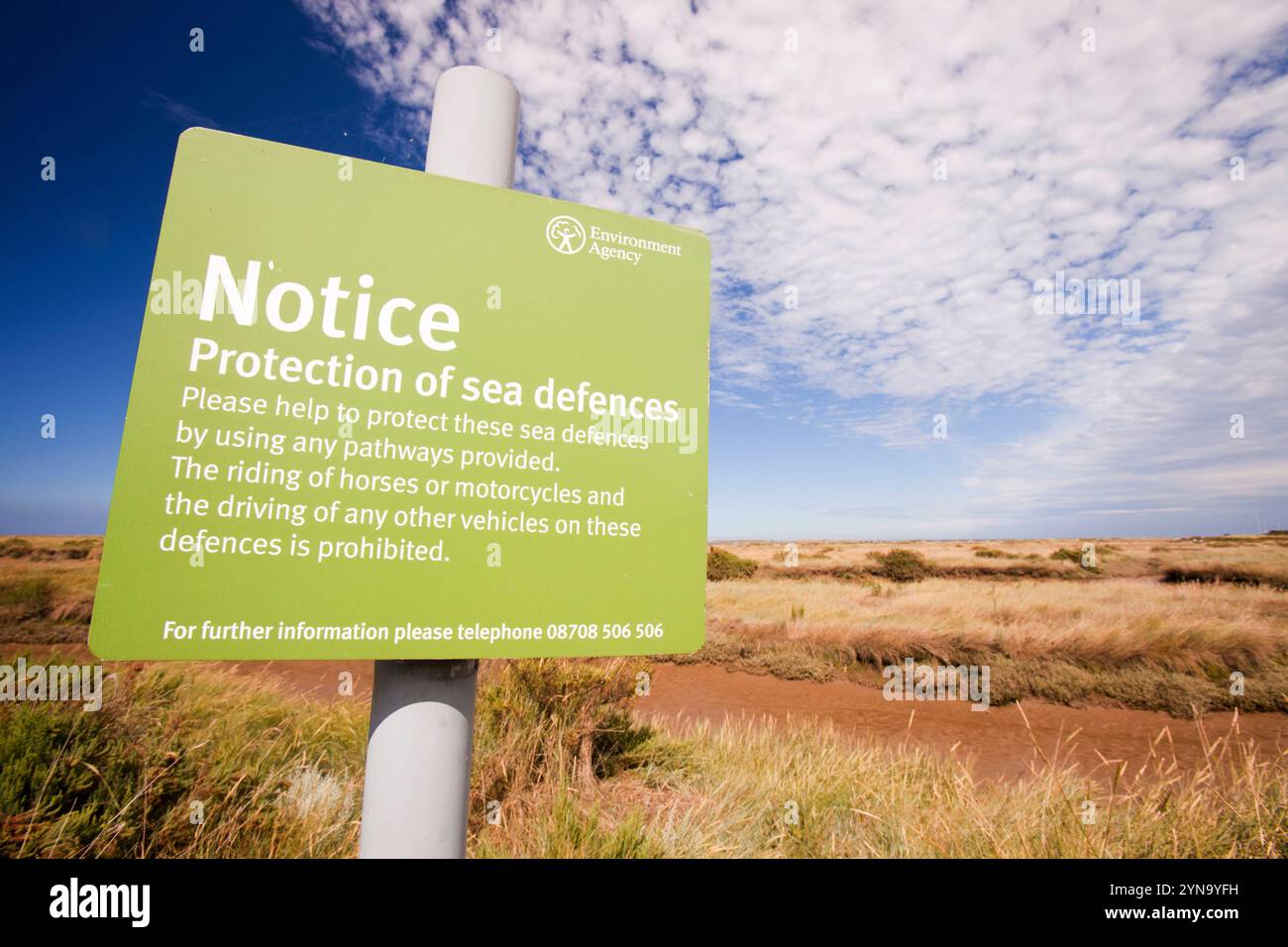 Warning sign regarding protection of coastal defenses Stock Photo - Alamy