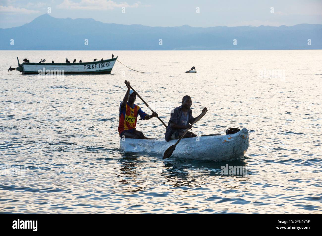 Fisherman in traditional dug out canoe, Cape Maclear, Lake Malawi ...