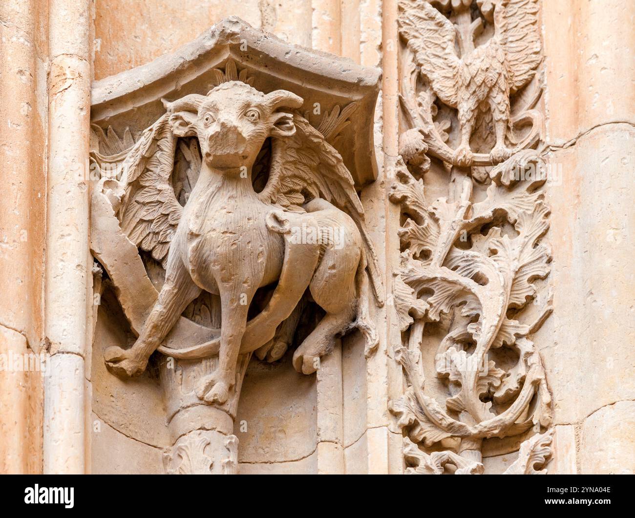 A detailed winged creature adorns the facade of an ancient building in ...