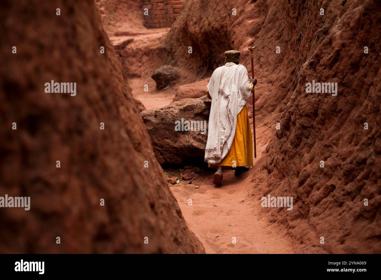 A woman walks through an ancient passageway in Lalibela, Northern ...
