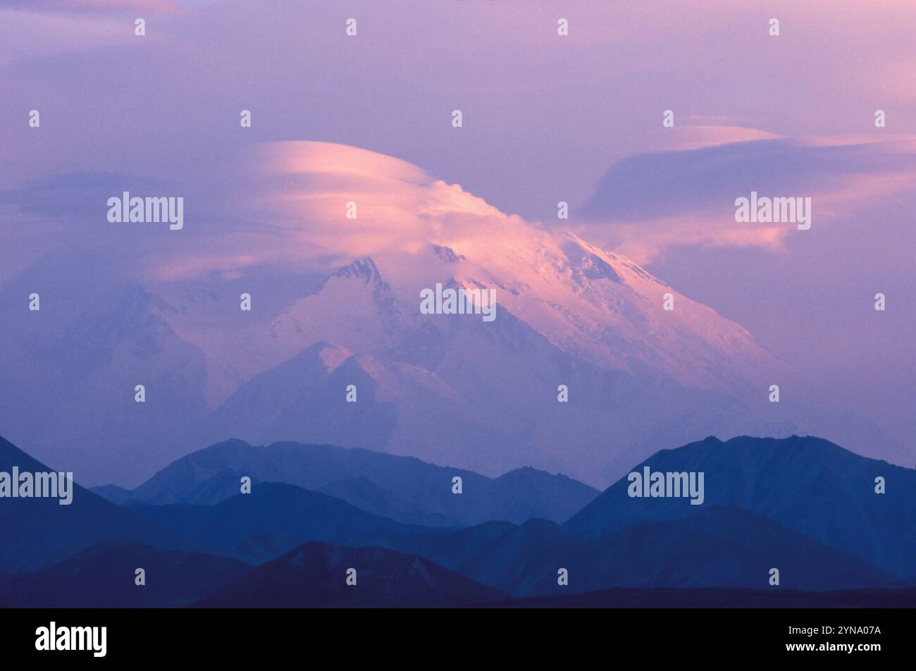 Lenticular clouds rise above Denali, also known as Mount McKinley, in ...