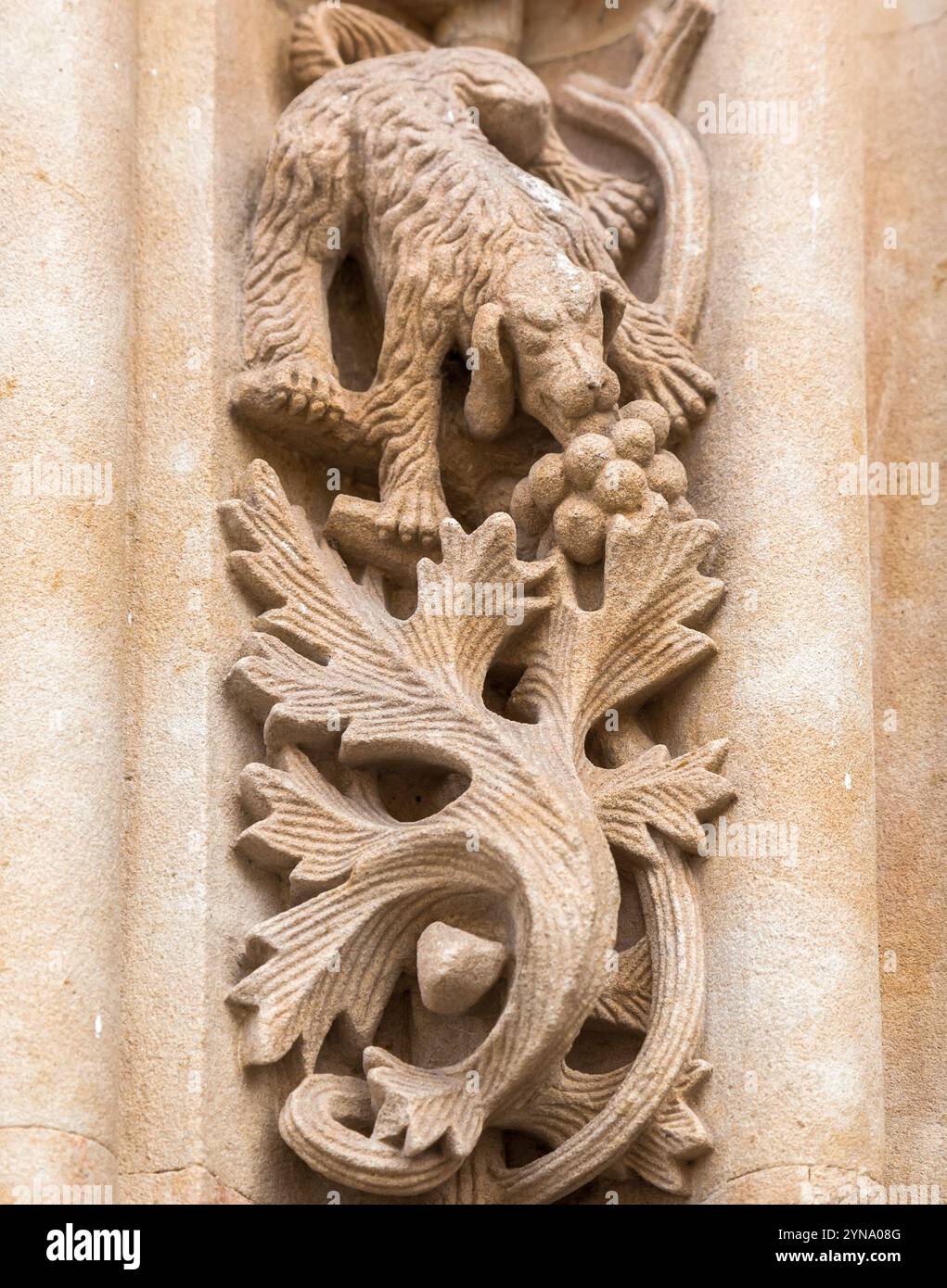 A detailed stone carving depicts a mythical creature perched atop a ...