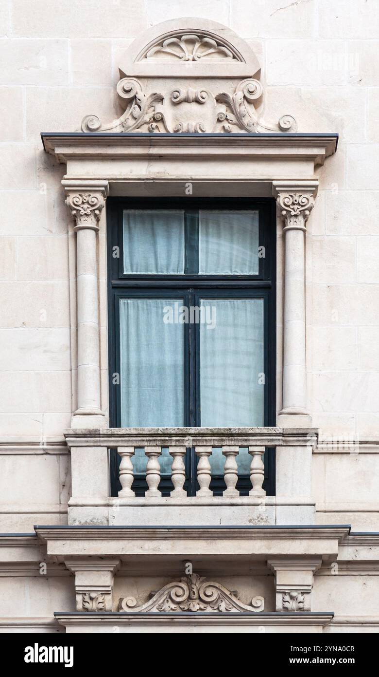 A beautifully crafted window with ornate columns and decorative motifs ...