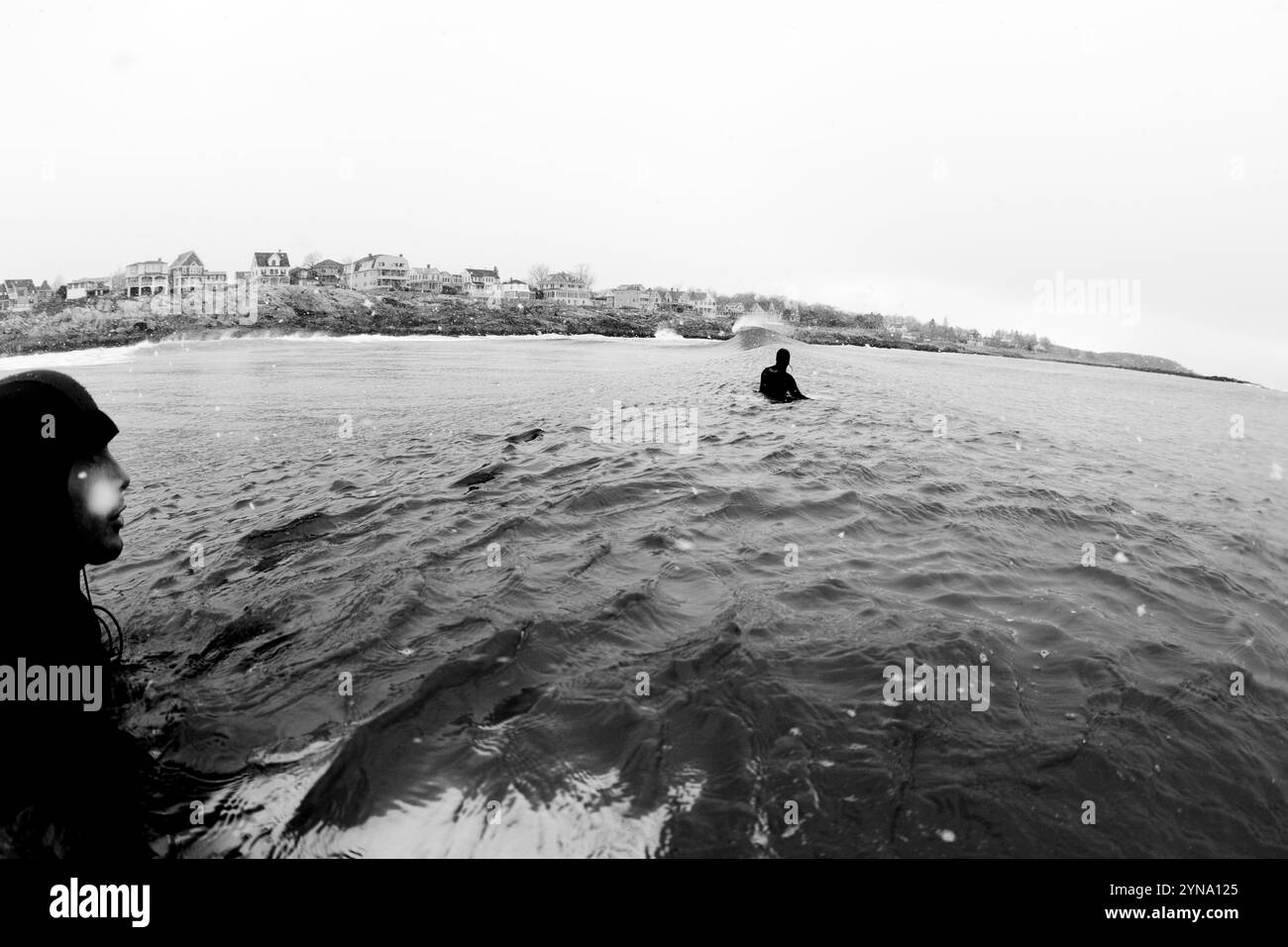 Winter surfers sit and wait for waves. Fisheye water shot Stock Photo - Alamy
