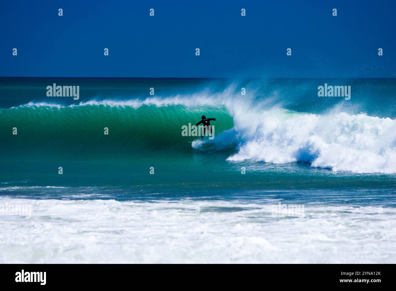 Winter surfer driving through green barrel Stock Photo - Alamy